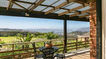 Suite Deluxe, varanda, vista para o mar | Refeições ao ar livre