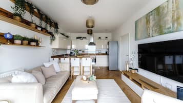 Apartamento Comfort, vista para o rio | Sala de estar