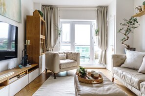 Apartamento Comfort, vista para o rio | Sala de estar