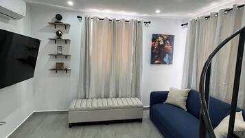 Apartamento Deluxe, vista para o oceano | Sala de estar