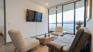 Apartamento, vista para a cidade | Área de estar