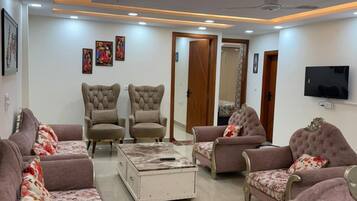 Quarto Deluxe, Vista para a cidade | Sala de estar