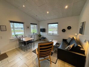 Apartamento Comfort, vista para o jardim | Sala de estar