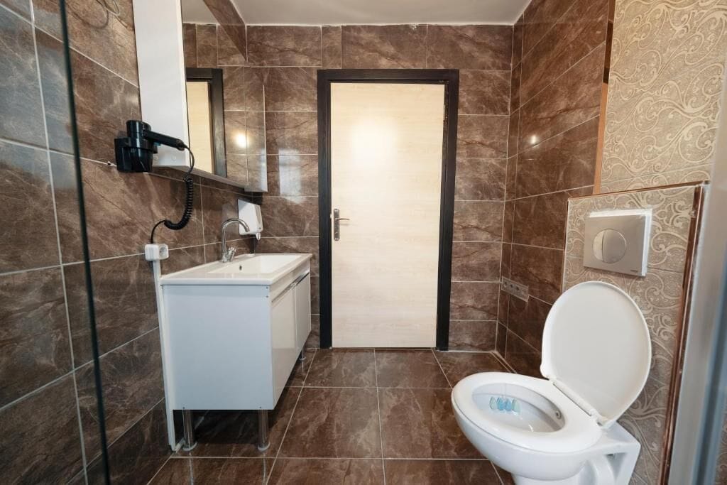 Suite Deluxe, Vista para a cidade | Casa de banho | Um secador de cabelo, toalhas fornecidas, sabão, champô 