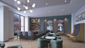 Um interior moderno com área de bar, assentos e vista através de uma grande janela.