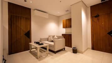 Apartamento, várias camas | Área de estar