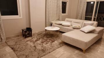 Apartamento, 2 quartos | Área de estar