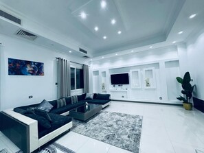 Villa Deluxe, vista para o jardim | Sala de estar