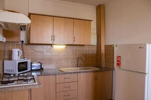 Apartamento, 1 quarto, varanda, vista para o pátio | Cozinha privada