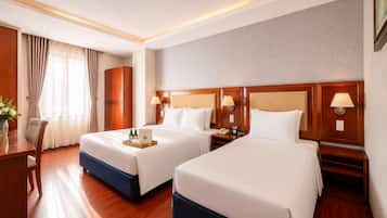 Quarto triplo luxo, vista para a cidade | Wi-Fi de cortesia, roupa de cama