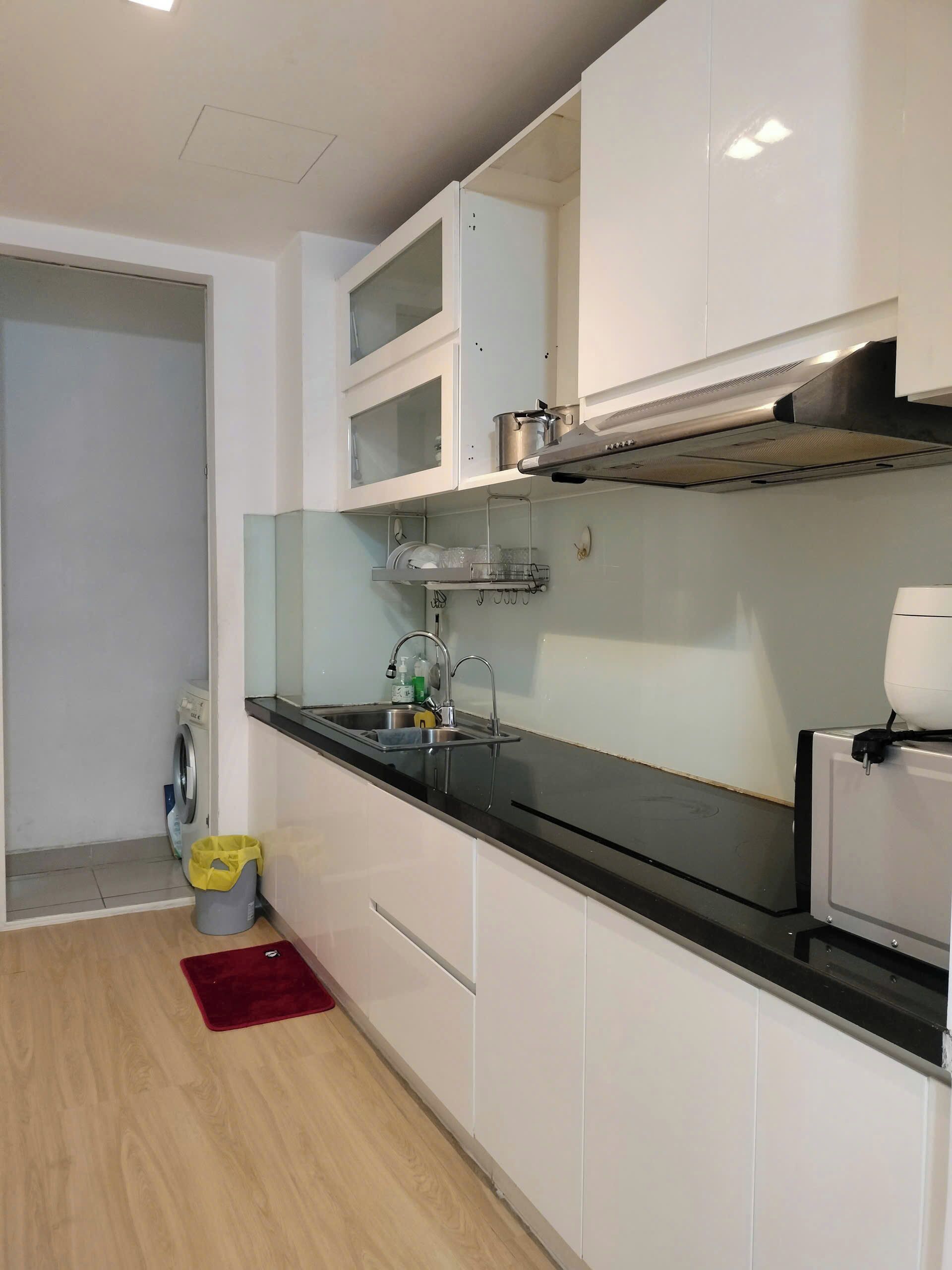 Apartamento família, sacada, vista para a cidade | Cozinha privada