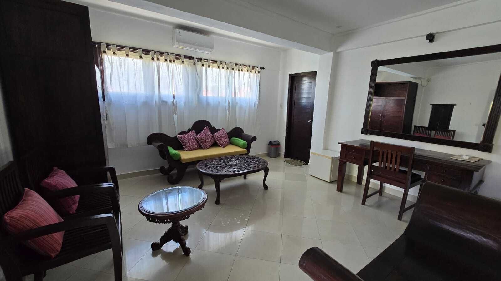 Quarto Deluxe, vista para o jardim | Sala de estar