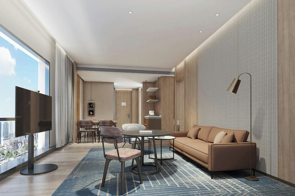 Suíte premier, 1 quarto, vista para a cidade | Sala de estar