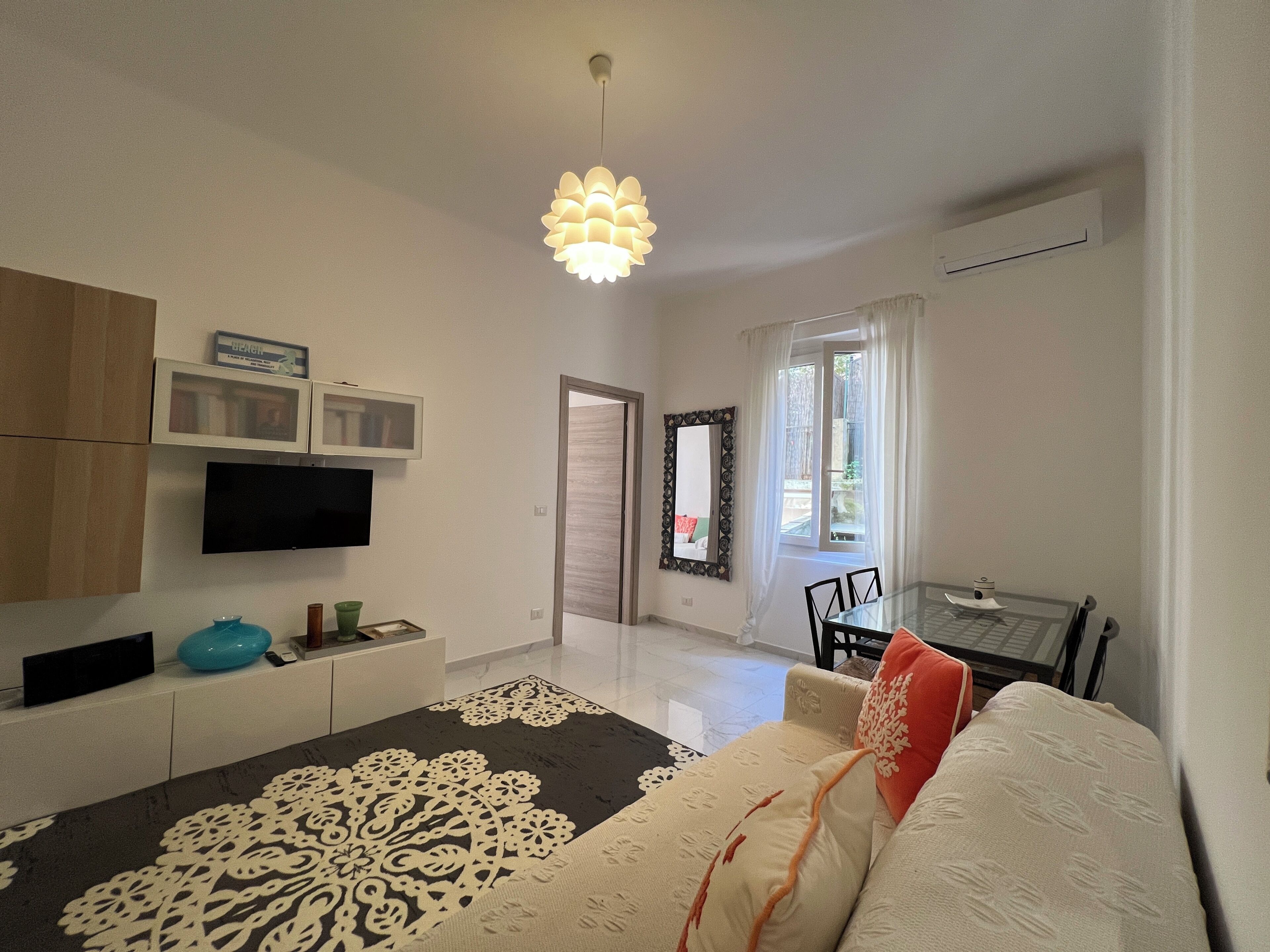Apartamento Deluxe, vista para o pátio | Sala de estar