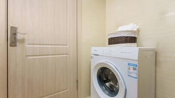 Suíte superluxo, vista para a cidade | Lavanderia
