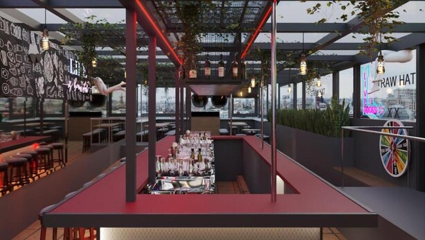 Uma área de bar moderna com balcão central, bancos e alvo de dardos.