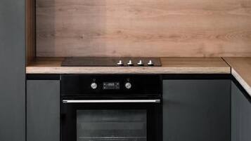 Apartamento Deluxe, 1 cama king-size e sofá-cama, Vista para a cidade | Cozinha privada