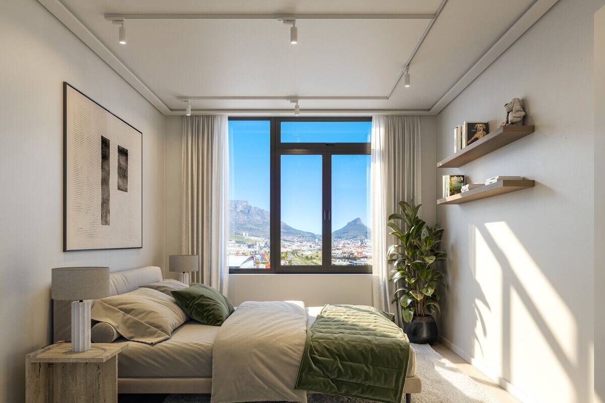Quarto com cama, mesas de cabeceira, janela com vista e estante de livros.