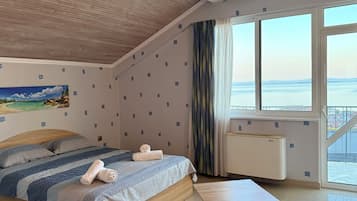 Quarto, sacada, vista para o oceano