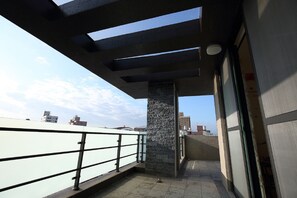 Quarto Quádruplo, 2 quartos, Vista para a cidade | Varanda