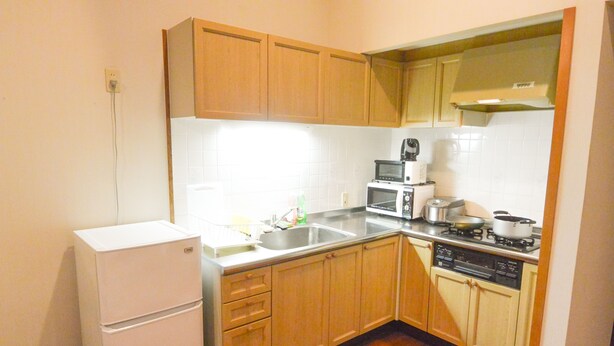Apartamento Familiar, várias camas, vista para o oceano | Cozinha privada | Uma cafeteira/bule, um frigorífico/congelador grande, um micro-ondas 