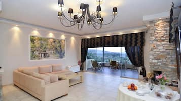 Apartamento, vista para o mar | Área de estar