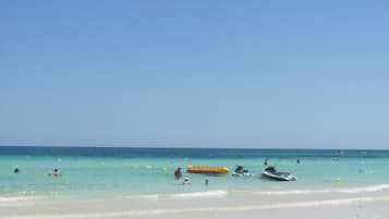 Praia particular, prática de vôlei de praia