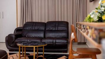 Quarto executivo | Área de estar | TV LCD