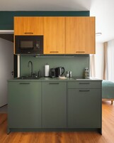Suíte conforto, 1 cama Queen e sofá-cama | Cozinha privada | Máquina de café expresso, chaleira elétrica
