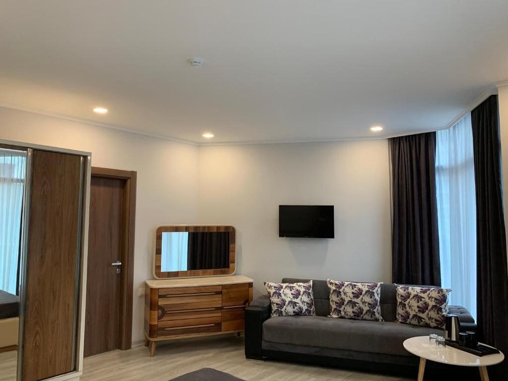 Quarto triplo luxo | Área de estar