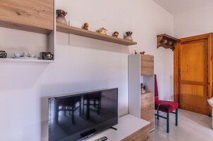Apartamento, pátio | Sala de estar