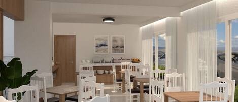 Uma zona de refeições moderna com mobiliário branco, uma mesa de madeira e vista através de grandes janelas.