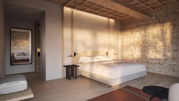 Quarto moderno com uma cama grande, parede de destaque em pedra e design minimalista.