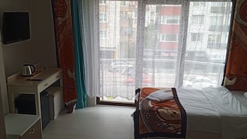 Quarto triplo standard | Frigobar, cofres nos quartos, Wi-Fi de cortesia, roupa de cama