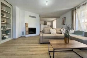 Apartamento Comfort, vista para o jardim | Sala de estar