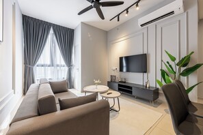 Apartamento, 2 quartos | Área de estar