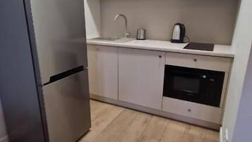 Quarto luxo, vista para o jardim | Cozinha privada