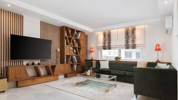 Apartamento Deluxe, vista para o jardim | Cofre no quarto, cortinas/cortinados opacos, quartos insonorizados