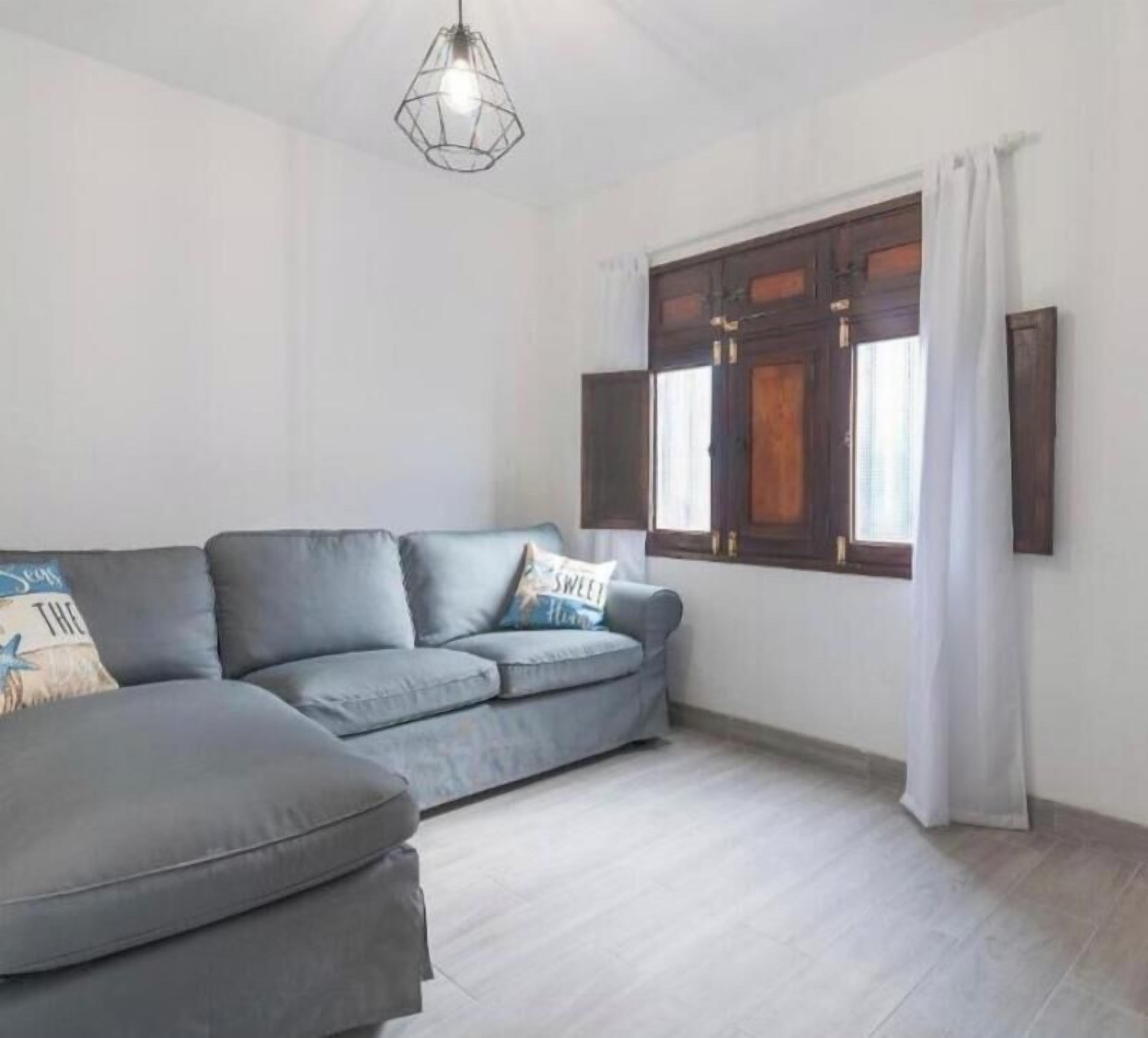 Apartamento, 1 quarto, terraço, vista para o oceano | Sala | Livros 