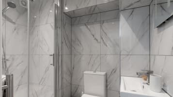 Apartamento luxo | Banheiro | Chuveiro, secador de cabelo, toalhas de banho, sabonete