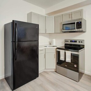 Estúdio design | Cozinha privada | Fogão, cooktop, talheres/pratos/utensílios de cozinha