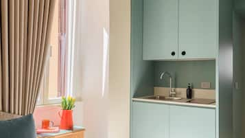 Quarto Quádruplo Deluxe, varanda | Sala de estar | Impressoras