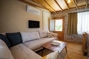Dúplex Familiar, vista para o pátio | Sala de estar