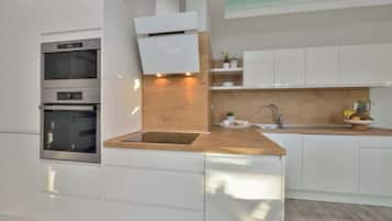 Apartamento (A4) | Cozinha privada | Geladeira, fogão, cooktop, lava-louças