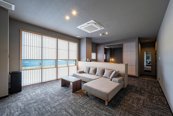 Suite Panorâmica, vista para o oceano | Sala de estar