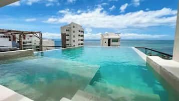 Apartamento conforto, sacada, vista para a praia | Piscina | Piscina externa
