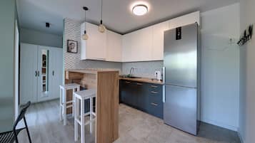 Apartamento, varanda | Kitchenette privada