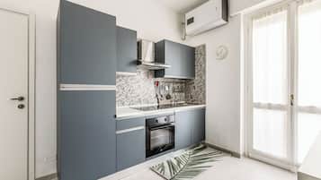 Apartamento, varanda | Cozinha privada