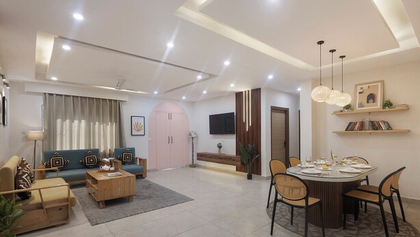 Uma sala de estar moderna com sofá, mesa de centro e mesa de jantar para seis pessoas.