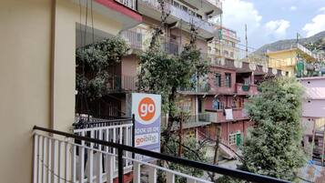 Quarto Duplo Deluxe, Vista para a cidade | Varanda